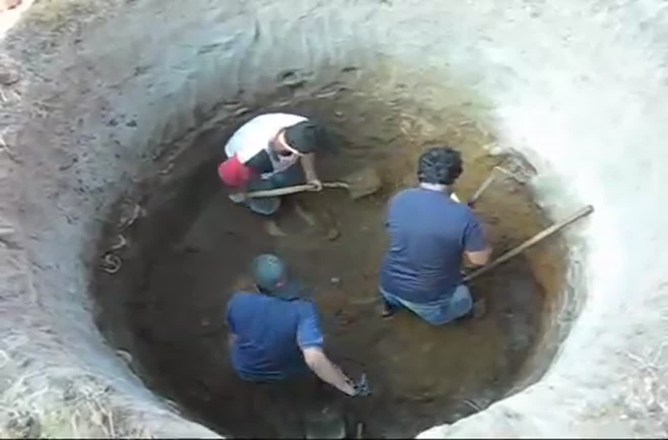 Hand digging a full-sized well in Mexico.