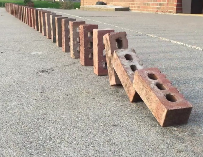 Watching a double domino effect with bricks is incredibly satisfying.
