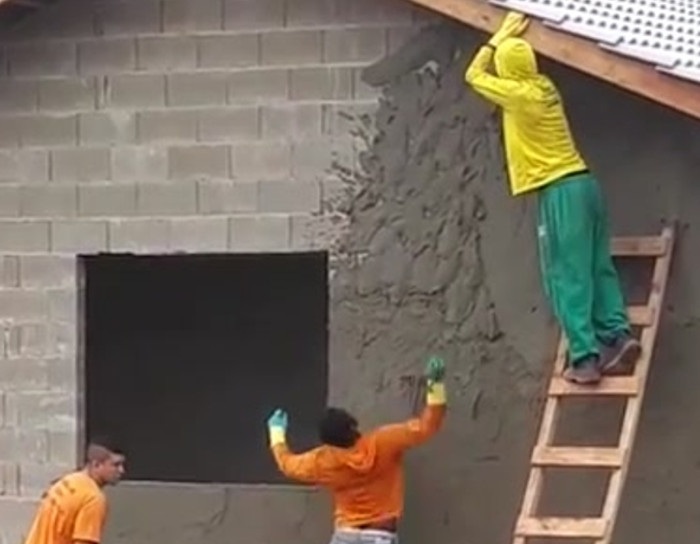 Mason worker is so good at his job that he doesn't even need scaffolding.