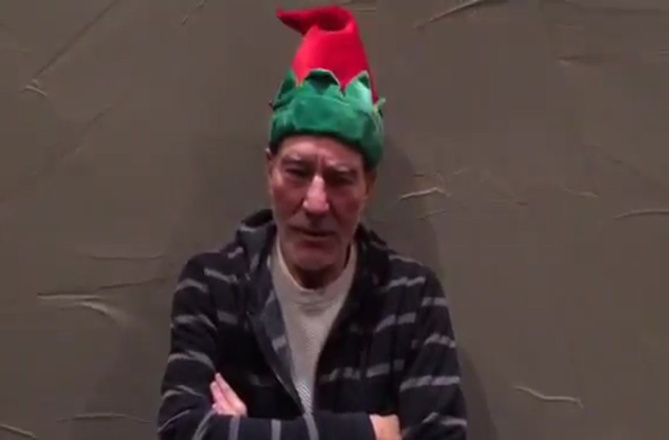 Patrick Stewart shows his Christmas spirit with a crazy holiday hat.