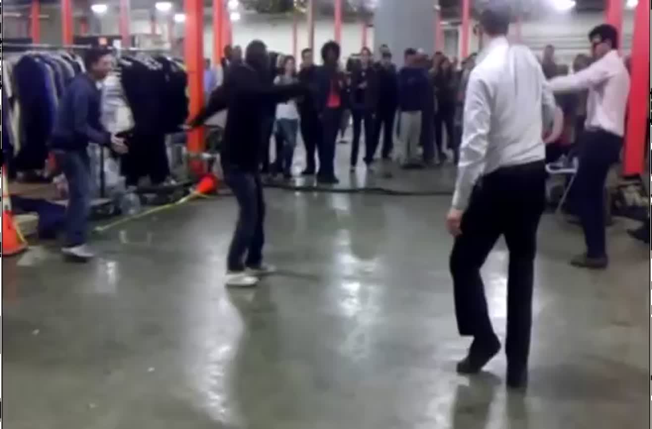 Stuntman dressed as cop accepts dance battle.