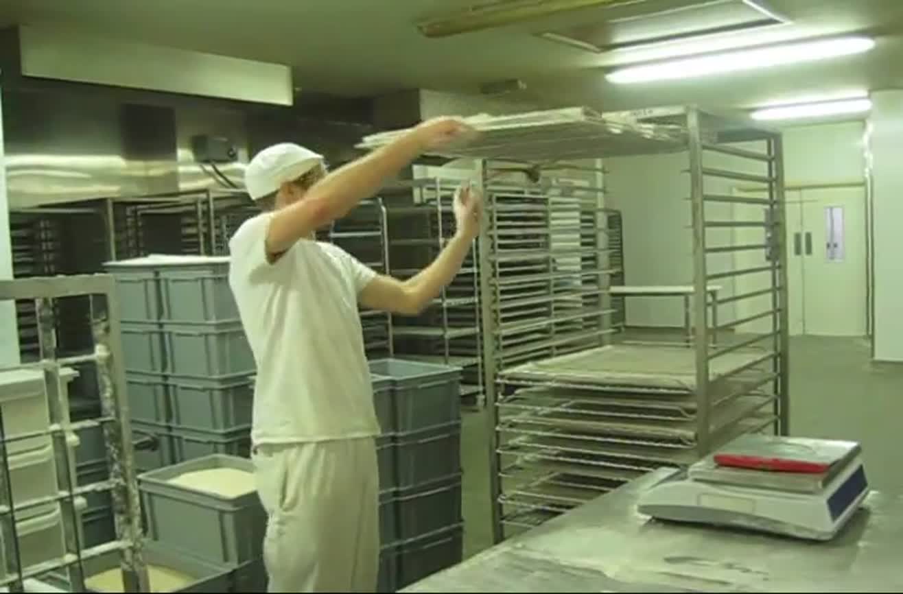 A very enthusiastic and efficient bread maker at work.