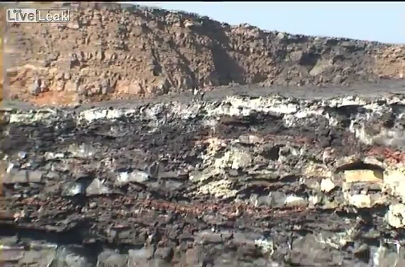 This is what happens if a box of garbage falls into a volcano lake.