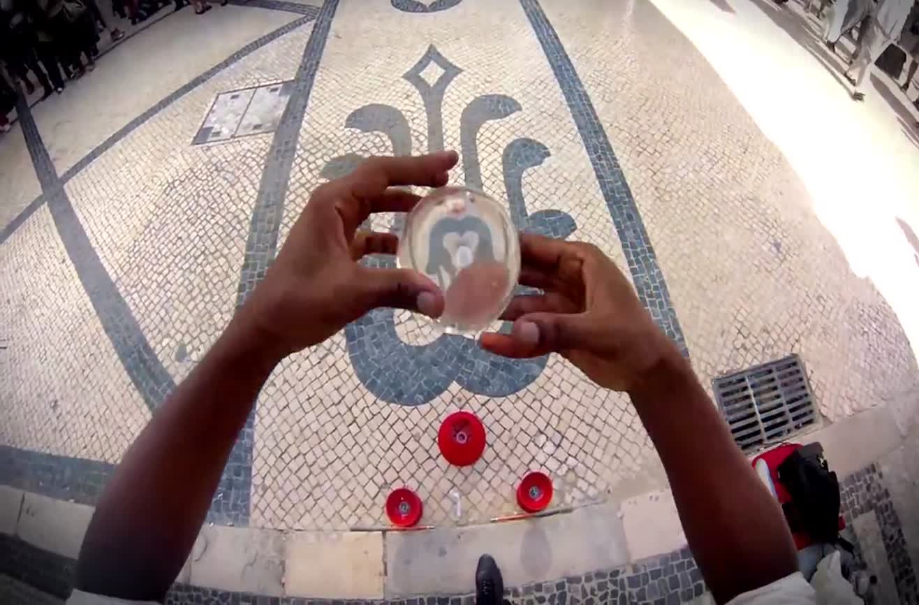 Mesmerizing POV video of a street performer juggling.
