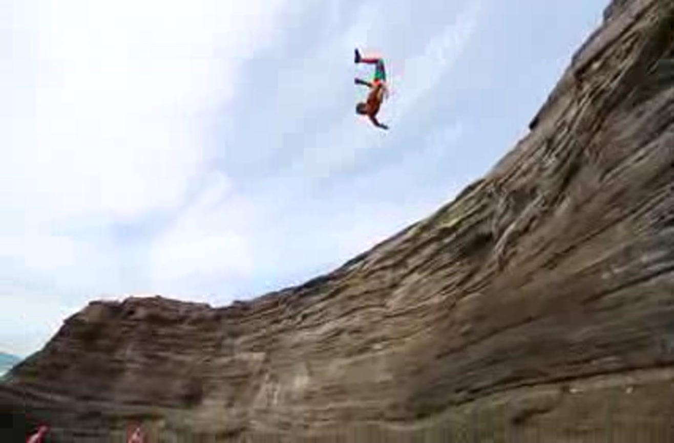 Daredevils go cliff jumping in Hawaii. Daredevils go cliff jumping in Hawaii.