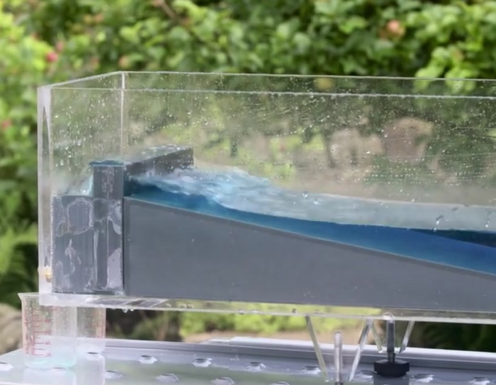 Wave tank demonstration showing the impact of coastal defenses on flood ...