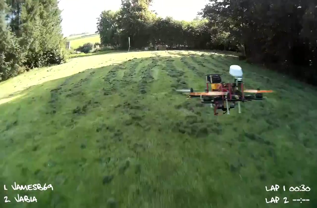 Mini quadcopters race each other through an advanced obstacle course.