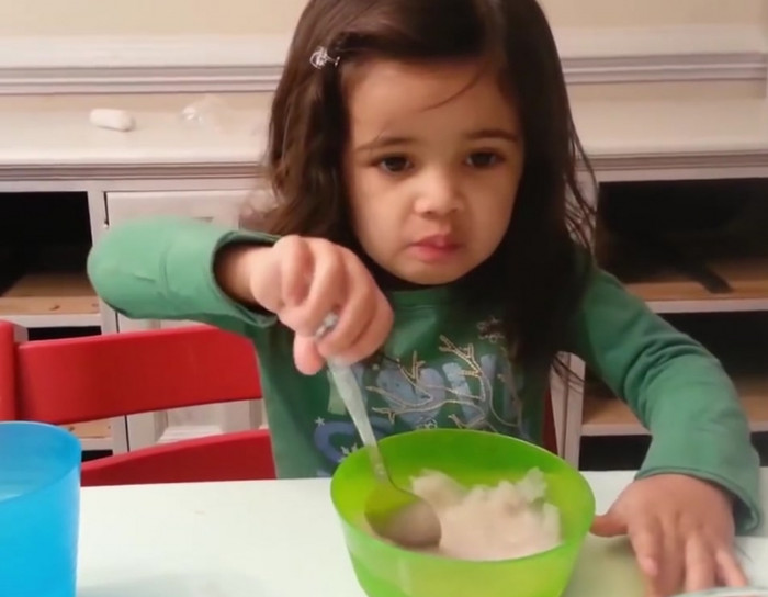 Little girl gets brain freeze for the first time.