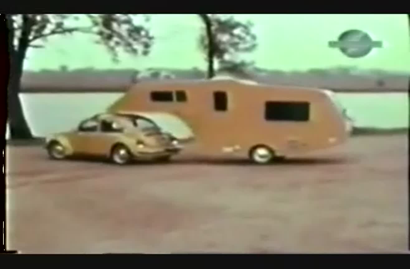 This idea never took off: VW Beetle pulls fifth wheel travel trailer.