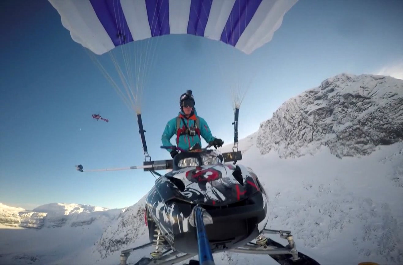 Here's what happens when you strap a parachute to a snowmobile and ride ...