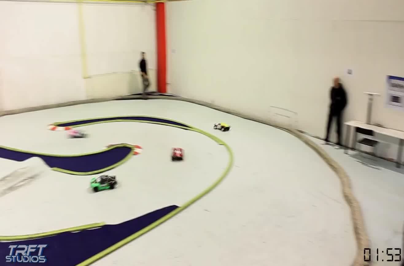 Indoor car race between RC cars.