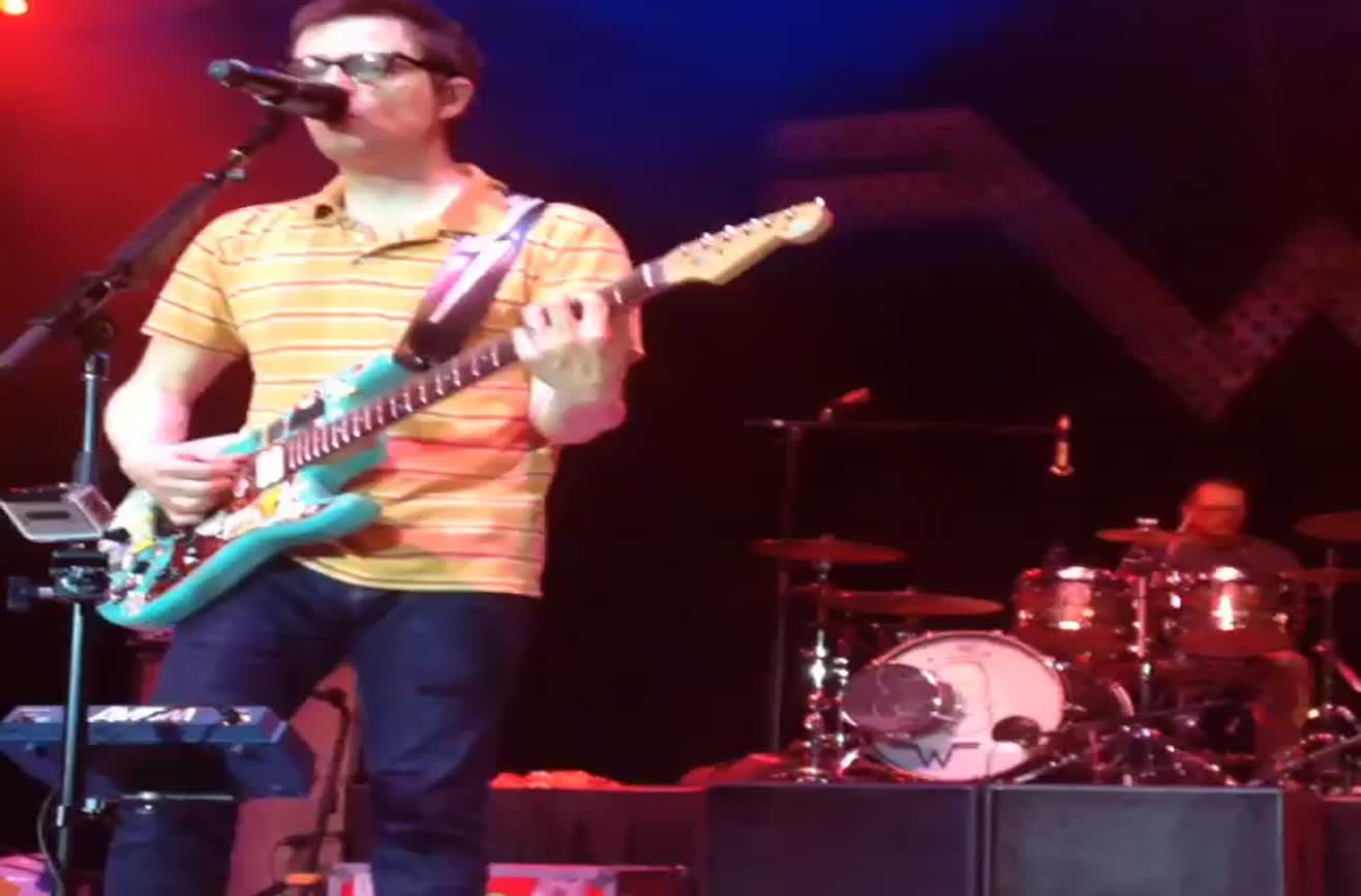 The drummer for Weezer catches a frisbee without missing a beat.