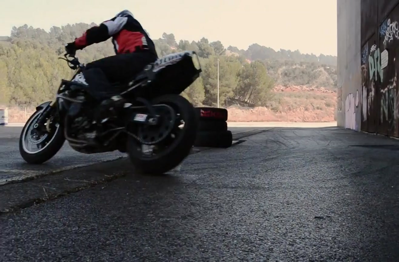 Drifting motorcycles crossing: Switch riders gymkhana.