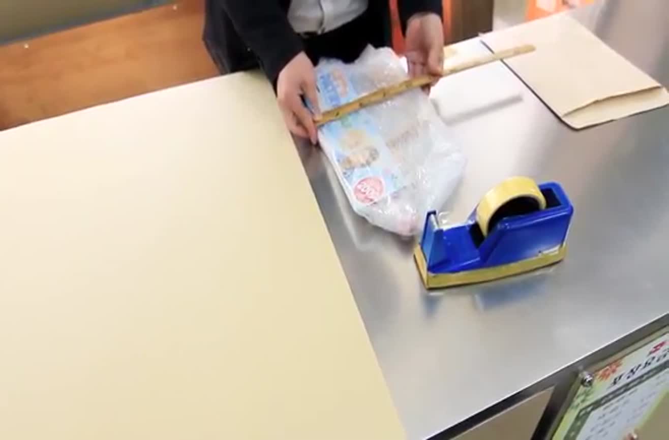 Making a custom sized box at the Korean post office.