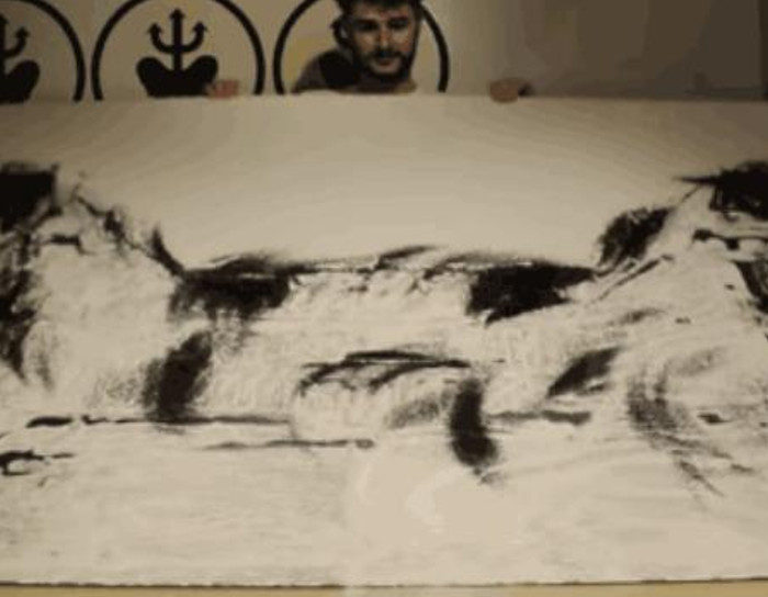 Man uses nothing but sand and paper to create works of art.