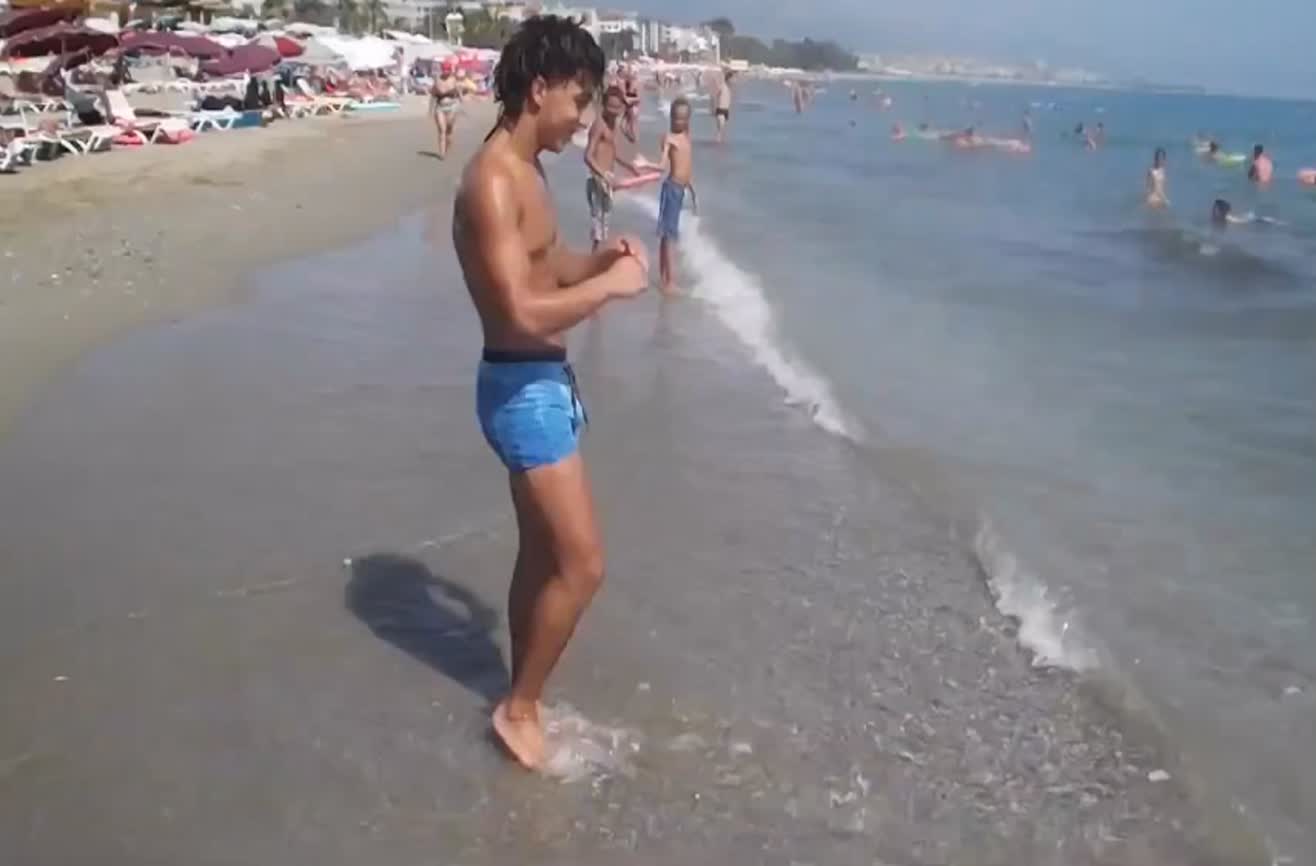 Backflipping beach guy.