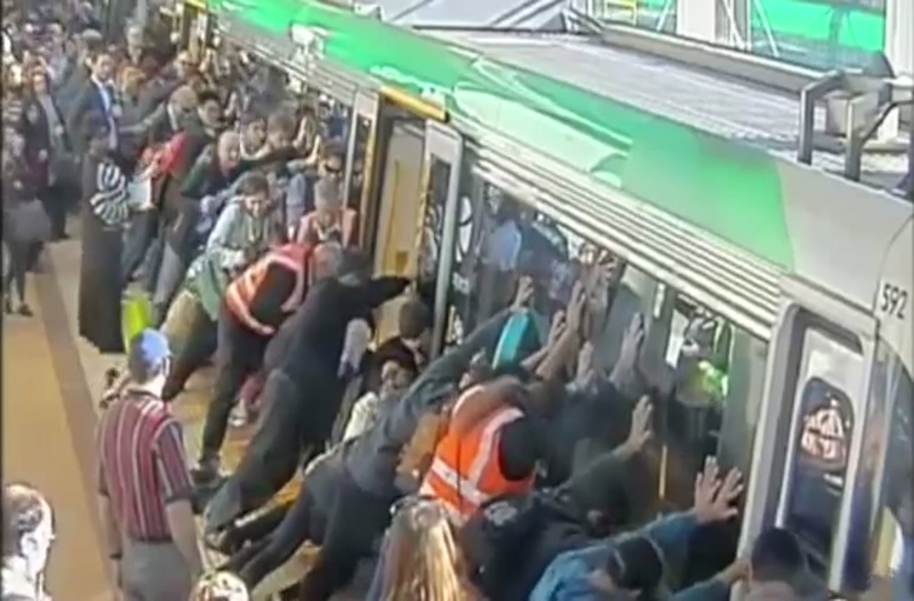 People power frees man trapped by train in Australia.