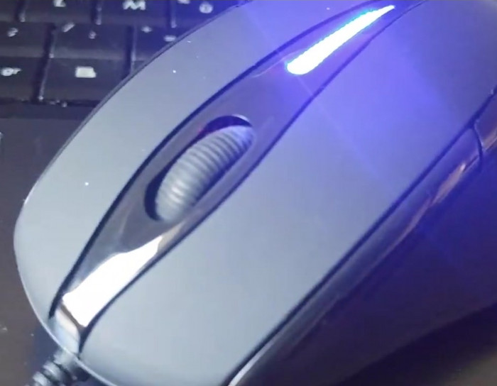 Guy performs a duet with his computer mouse.