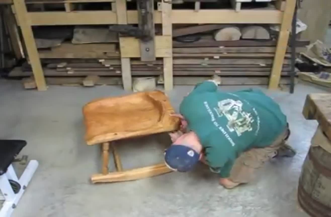 Man builds a rocking chair without using any power tools.