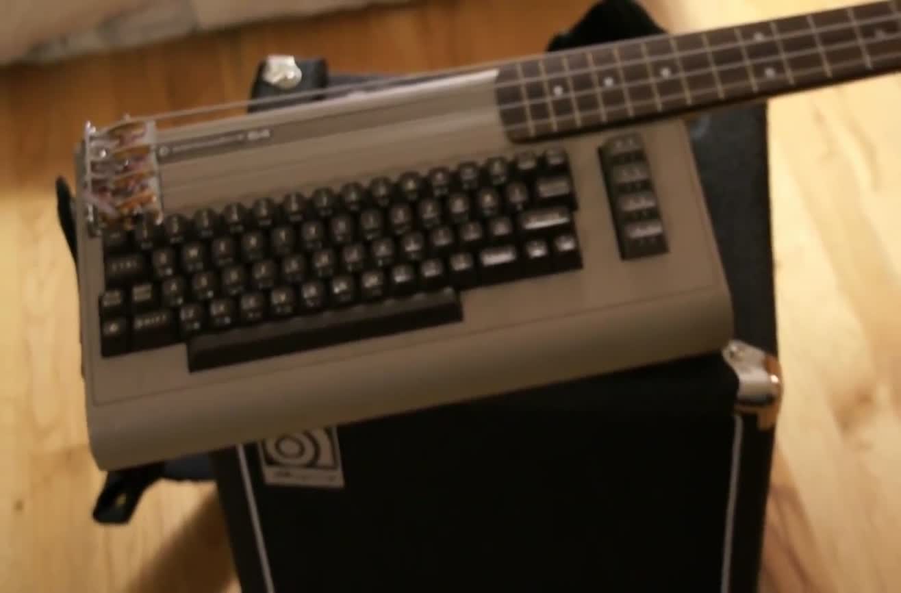 A bass guitar made from a Commodore 64.
