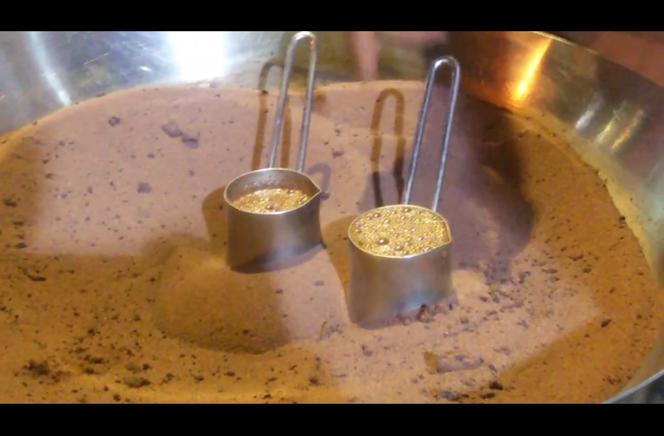 This vendor makes Turkish coffee using a pot of sand.