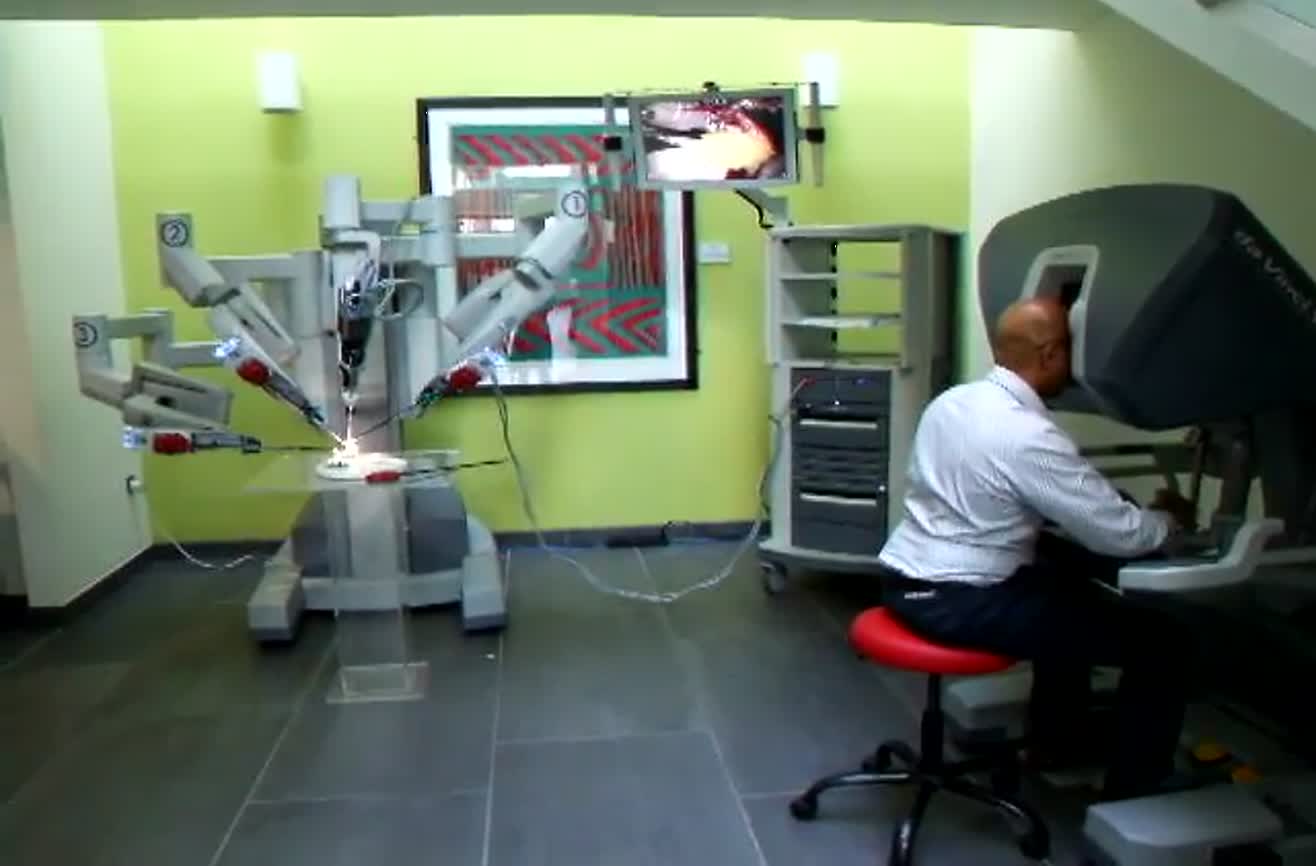 Surgical robot peeling a grape.