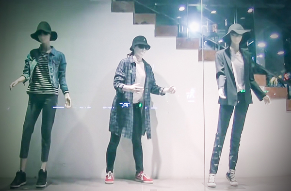 A girl poses as a mannequin, then breaks into a mesmerizing dance.