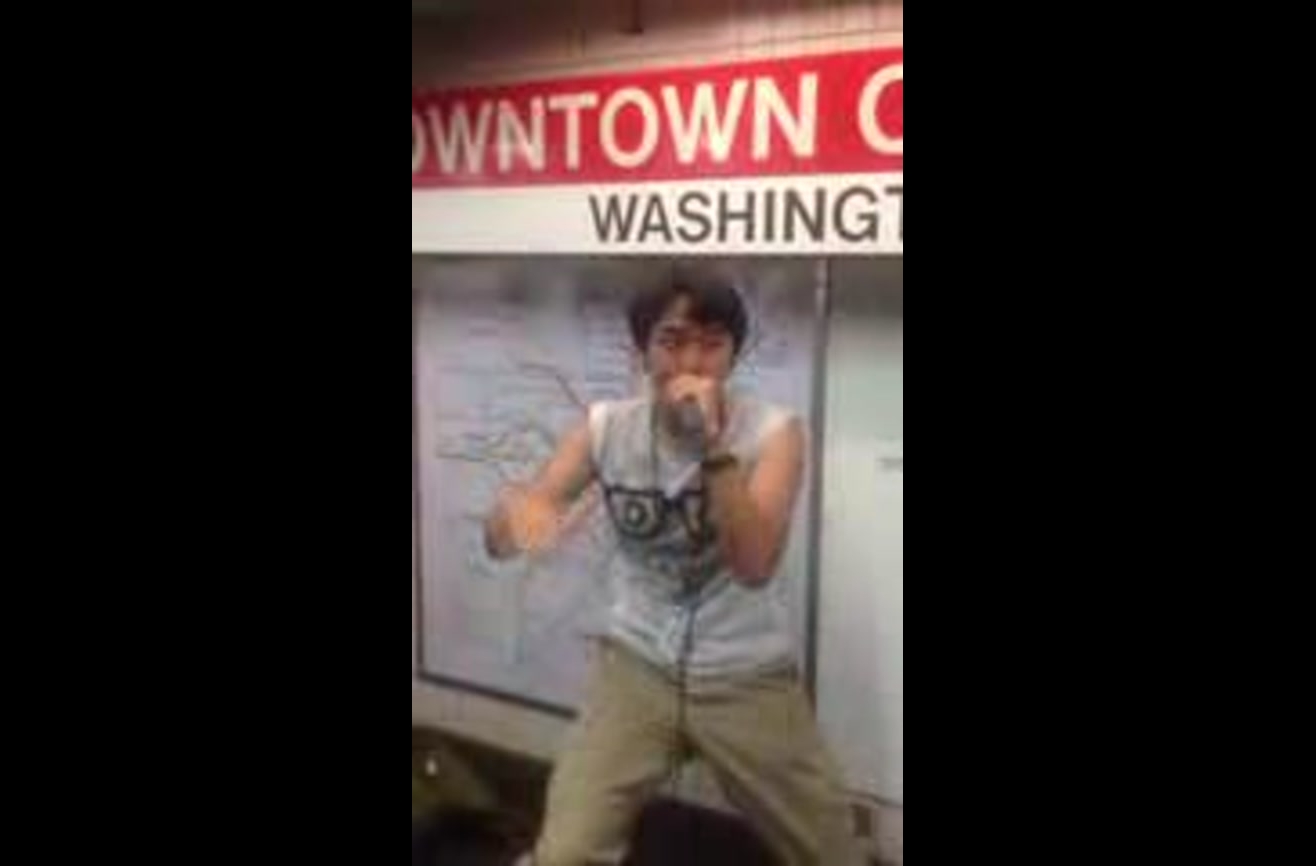 Professional beatboxer performs in a subway station.