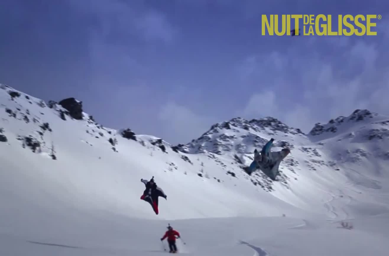 First ever wingsuit flying above skiers.