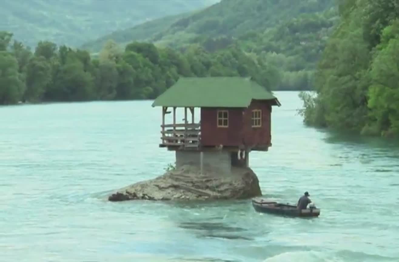Amazing house in the middle of a raging river.