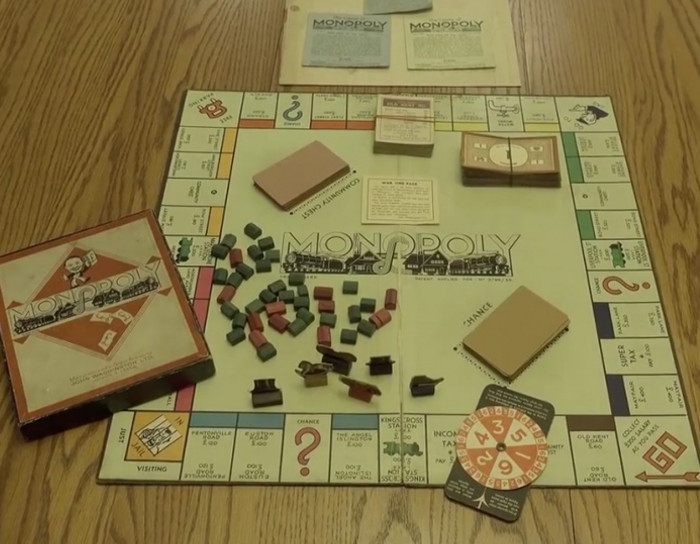 Opening a 1940s Monopoly War Time Edition.