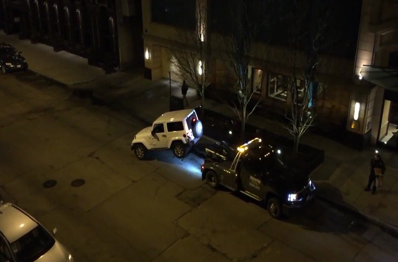 Watch the surprising way this guy gets out of having his car towed.