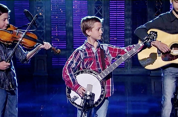 Nine-year-old boy stuns the crowd with his banjo skills.