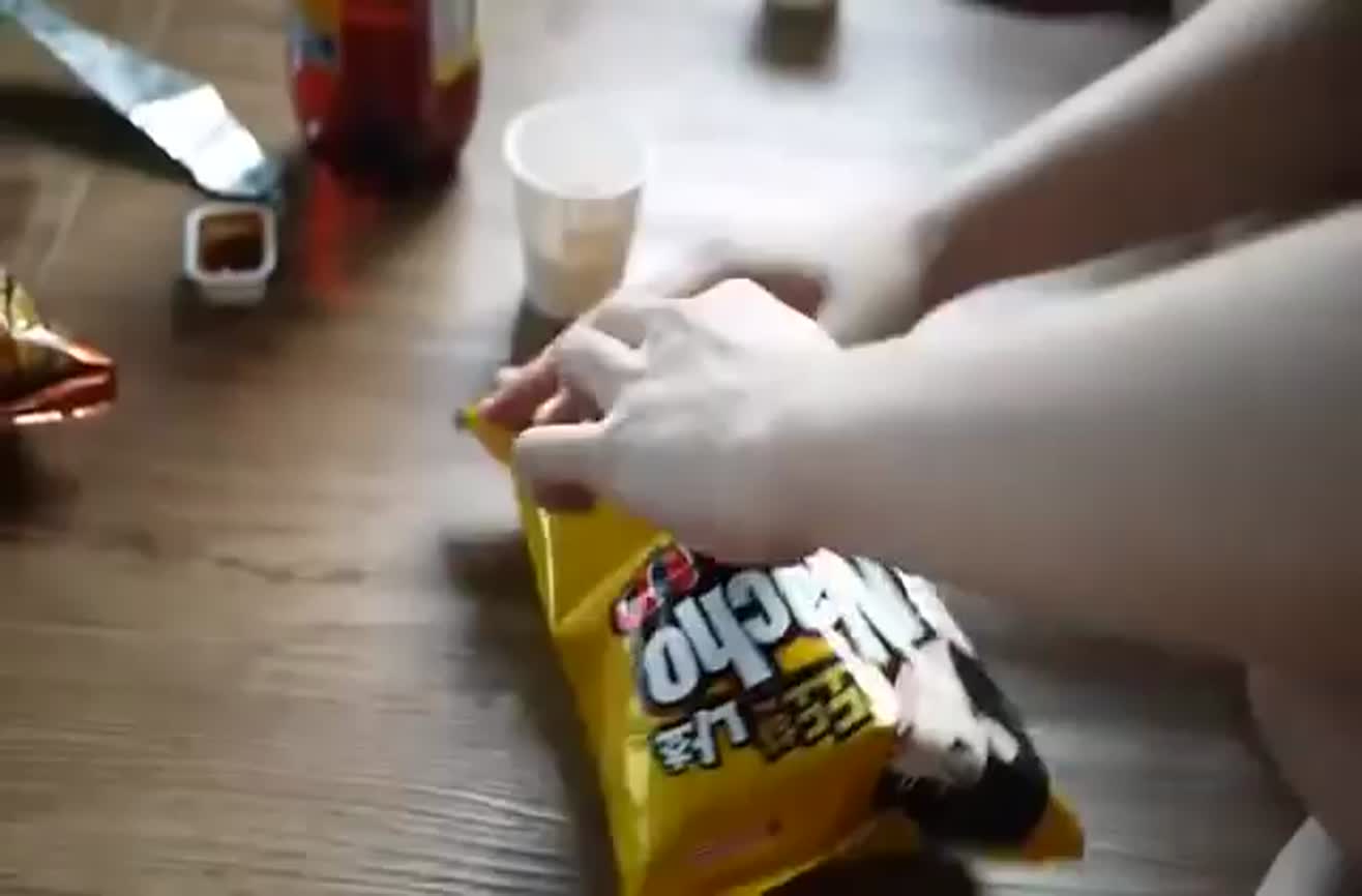 A clever way to open a bag of snacks.