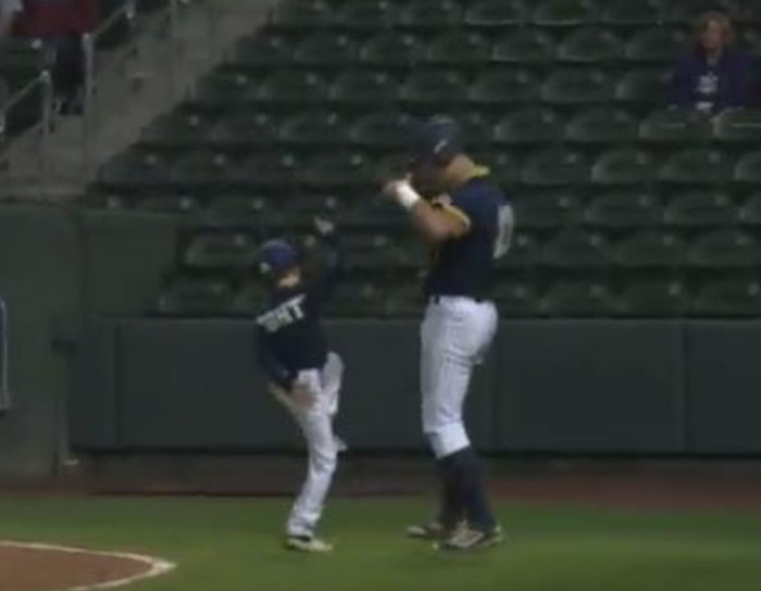 College baseball player and batboy are epic handshake partners.