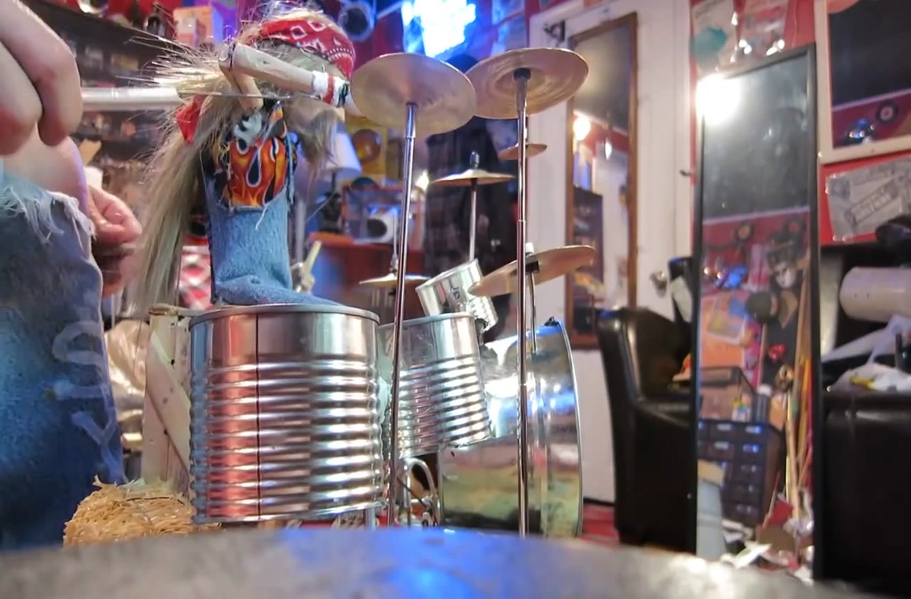 Talented puppet masters the drum solo from Rush's "Tom Sawyer".