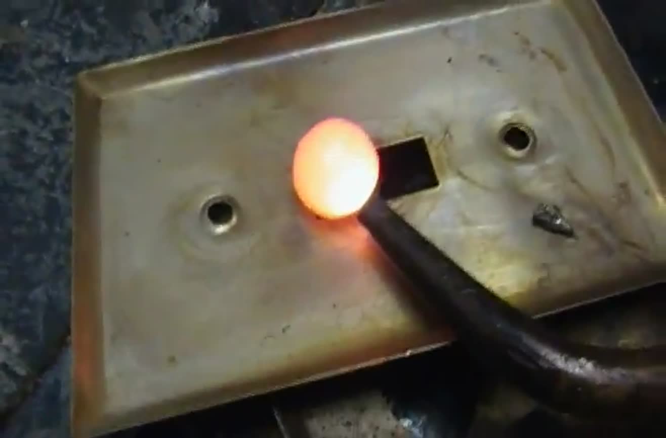 A red hot nickel ball in water.