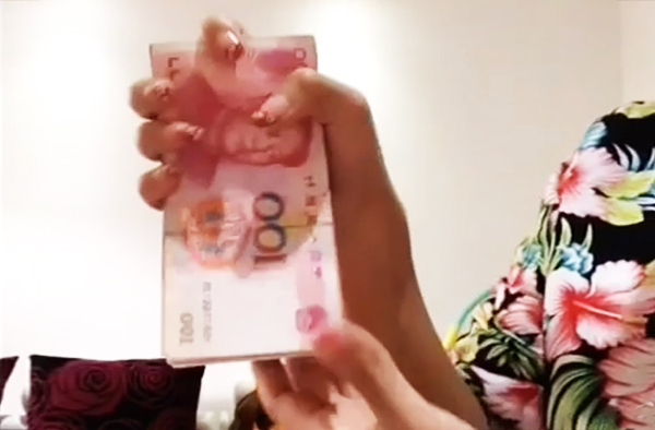 Lady Demonstrates The Fastest Way To Count A Stack Of Money lady-demonstrates-the-fastest-way-to-count-a-stack-of-money