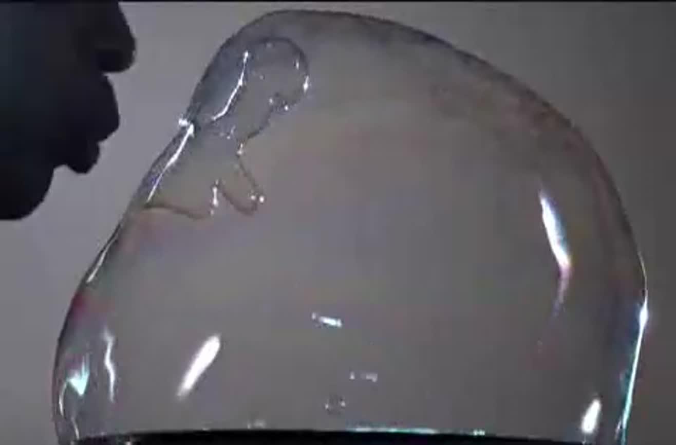 Bubble bursting in slow motion.