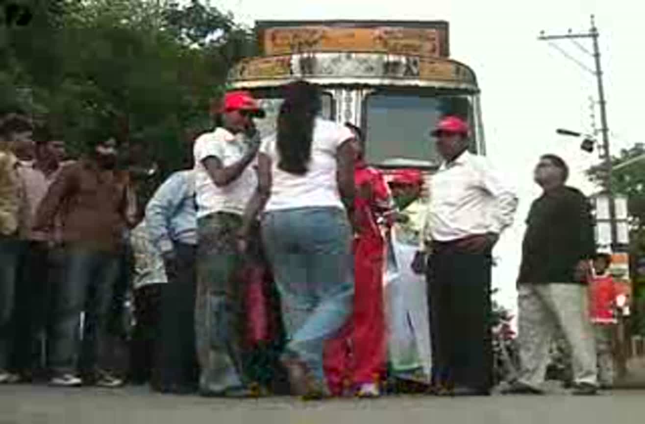 Indian girl pulls bus with her hair.