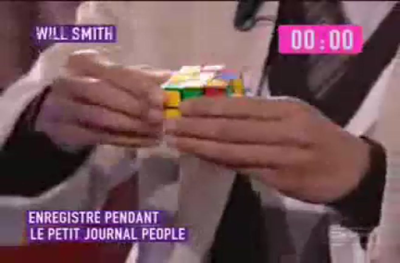 Will Smith tries to solve the Rubik's Cube.