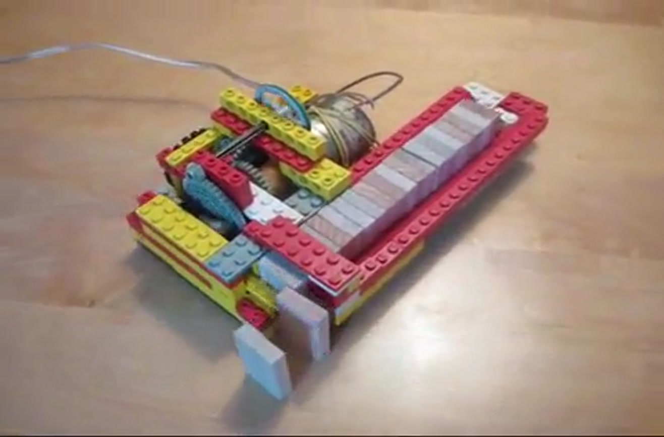 Domino building LEGO machine.