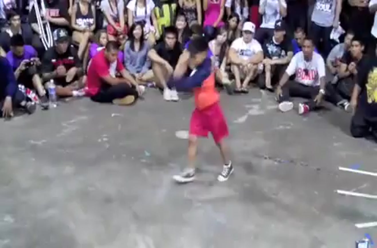 Breakdancing dance off: Eight-year-old dominates the floor.