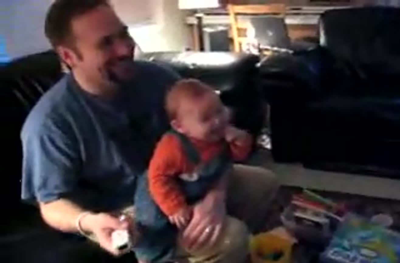 Baby loves his Nintendo Wii.