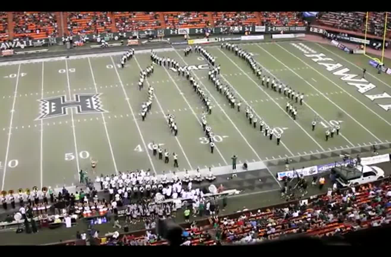 Marching band forms giant football player.