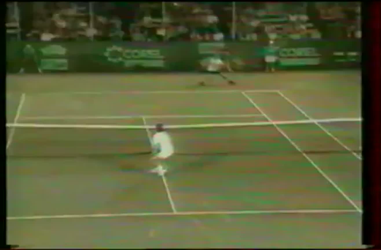 Tennis player Jimmy Connors throws his racket in the air and wins the ...