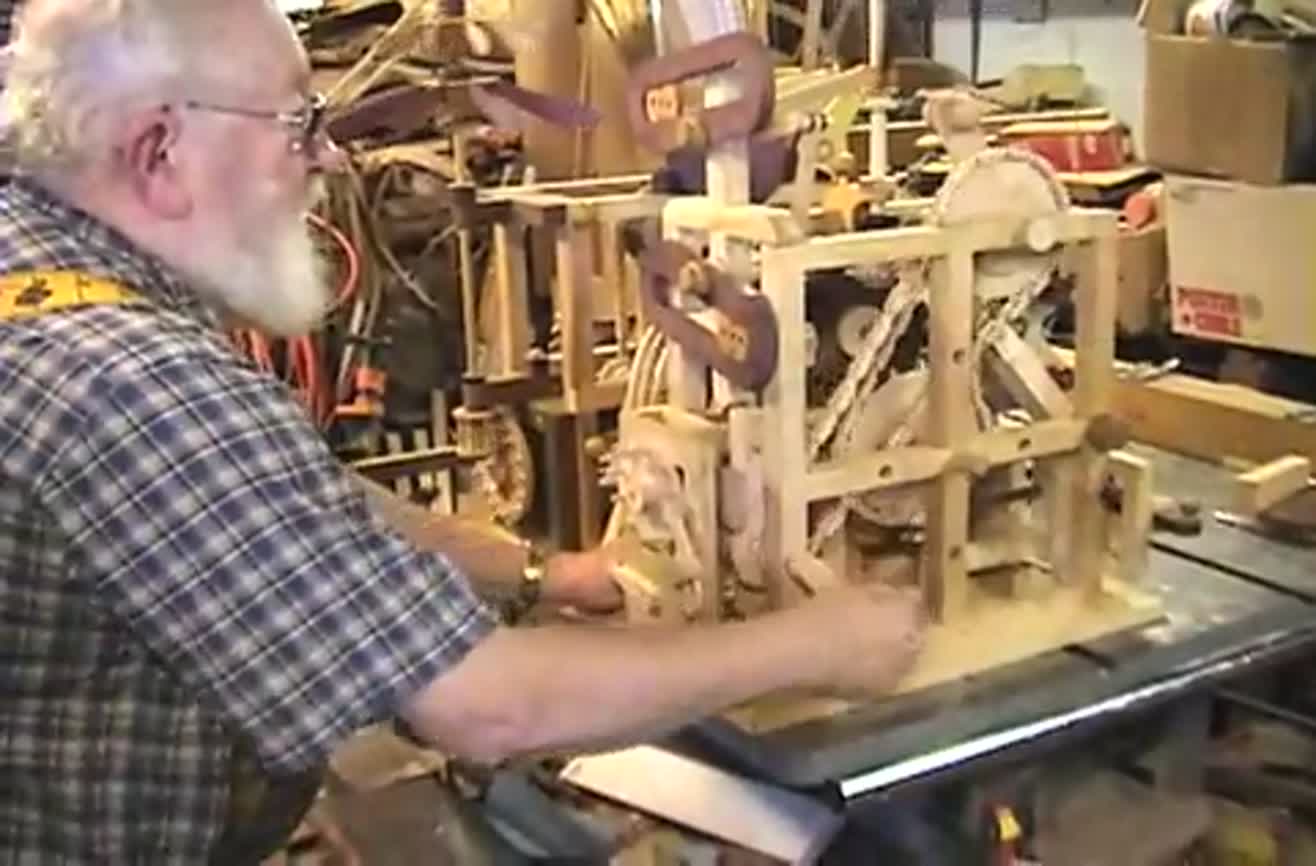 Intricate machine made entirely of wood.