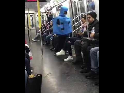 Human dreidel spinning on NYC subway