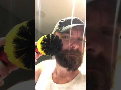 Man uses drill to trim his beard