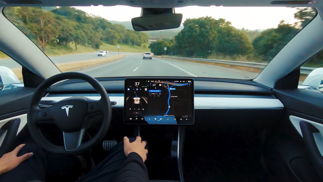 Taking a ride in a fully self-driving Tesla